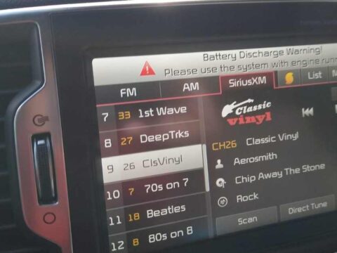 What does battery discharge warning mean on Kia Sportage?